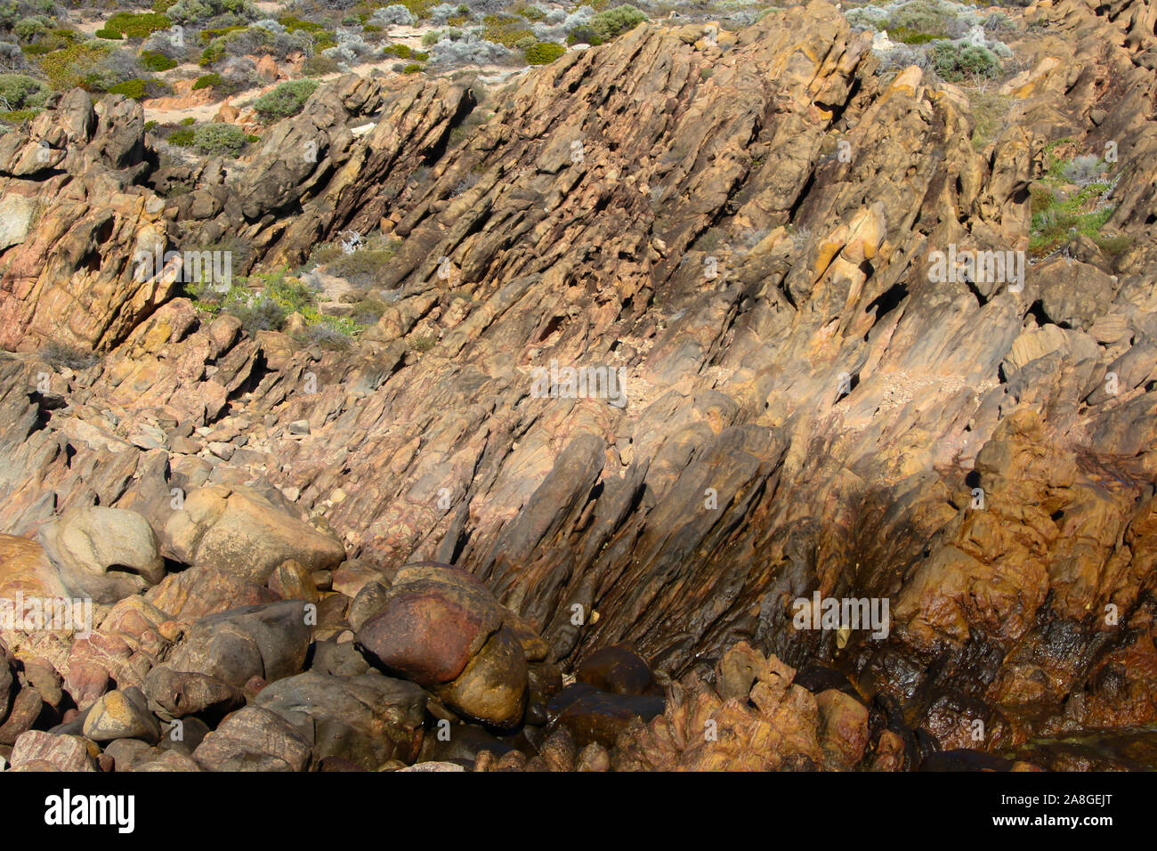 Scenic views of the Indian Ocean washing over the old gneiss ...
