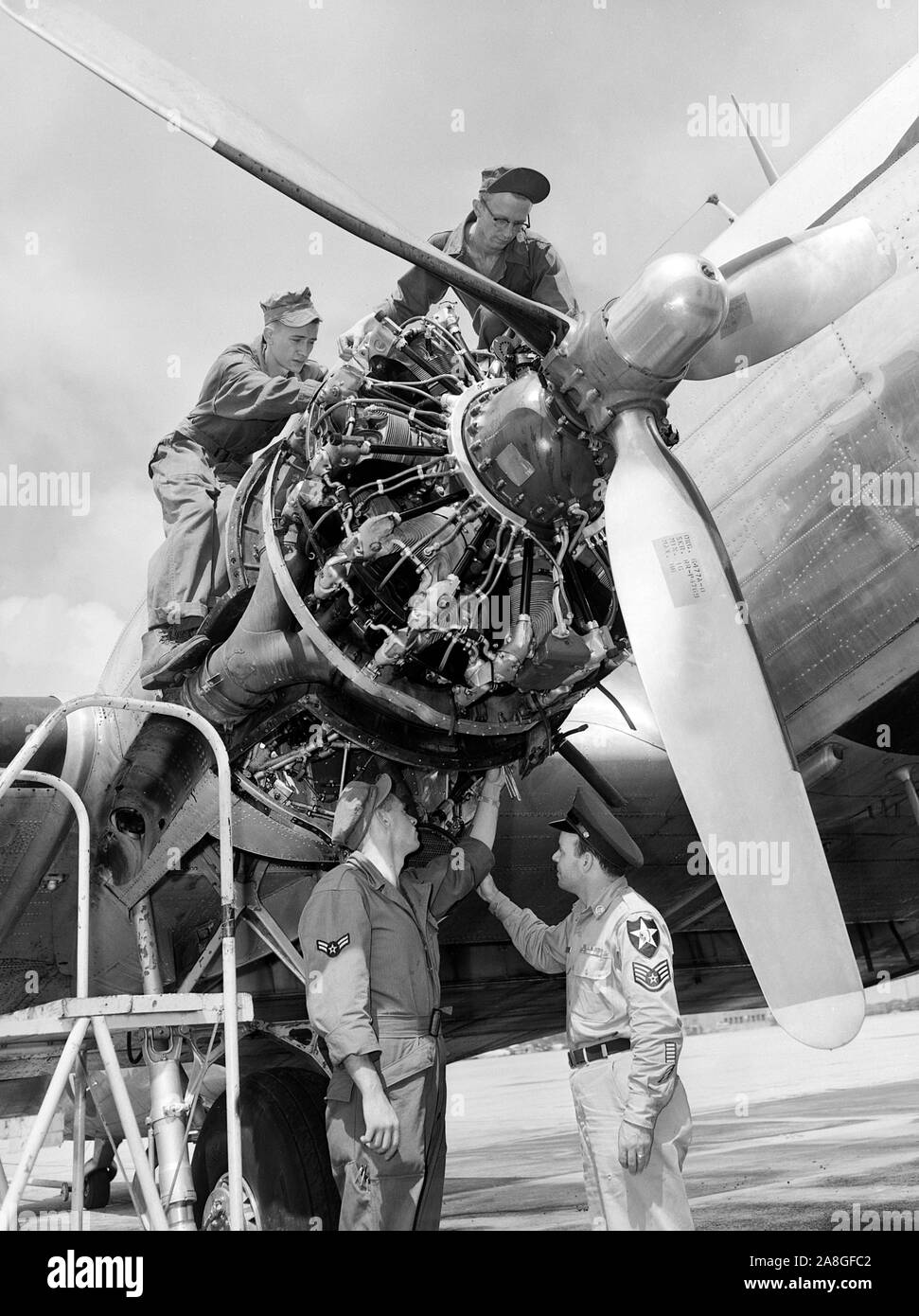 Members of the 437th Airlift Wing unit repair a aircraft at O'Hare ...