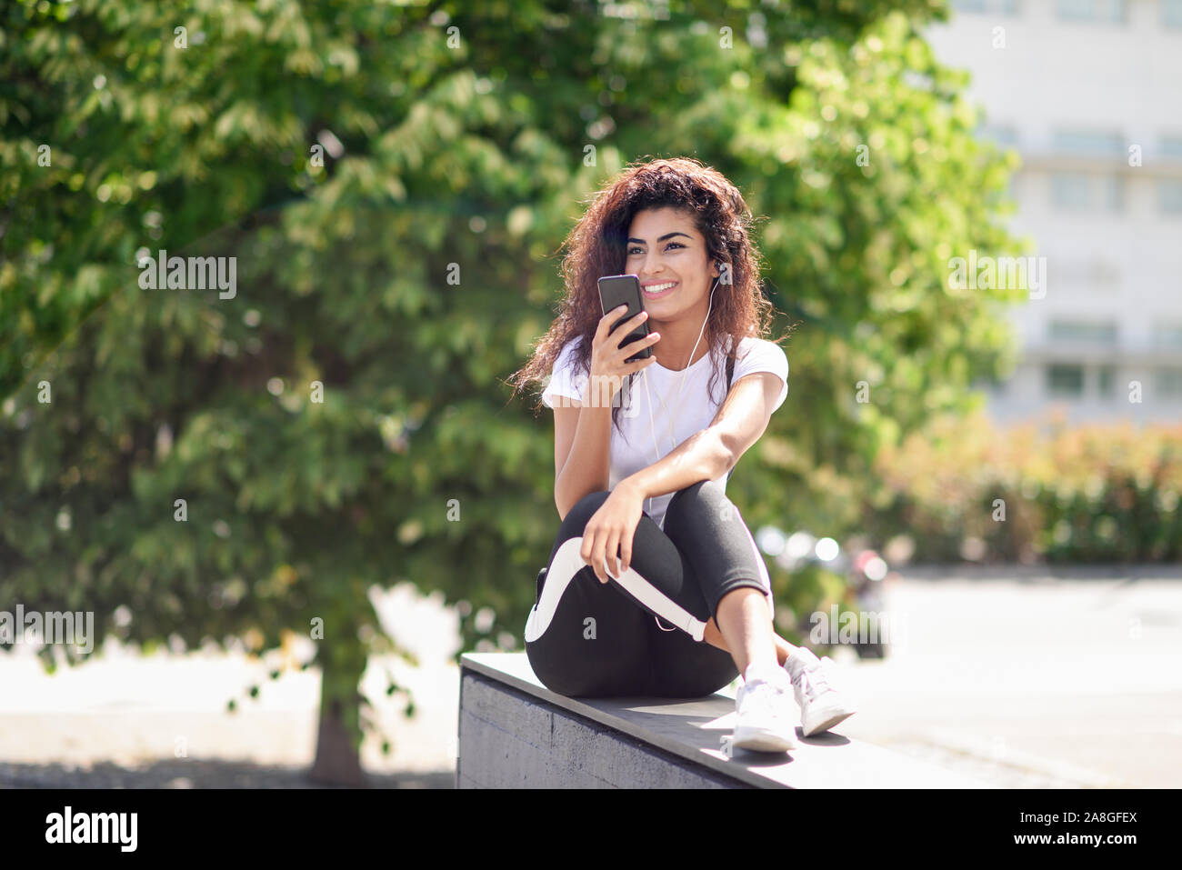 African woman recording a voice note with smart phone Stock Photo - Alamy