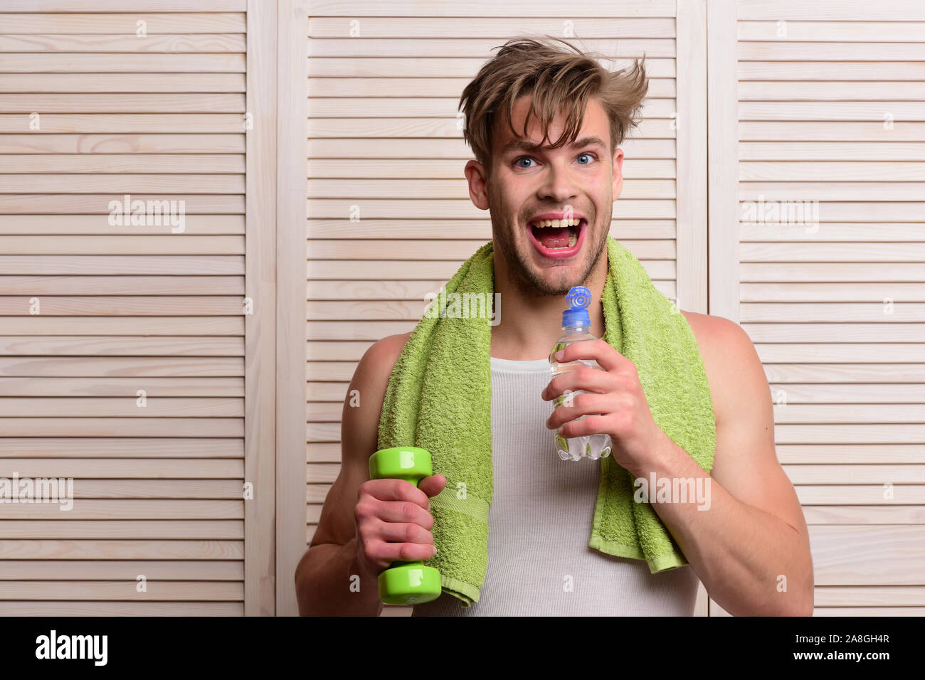 Morning exercises and healthy lifestyle concept. Man with bottle of ...