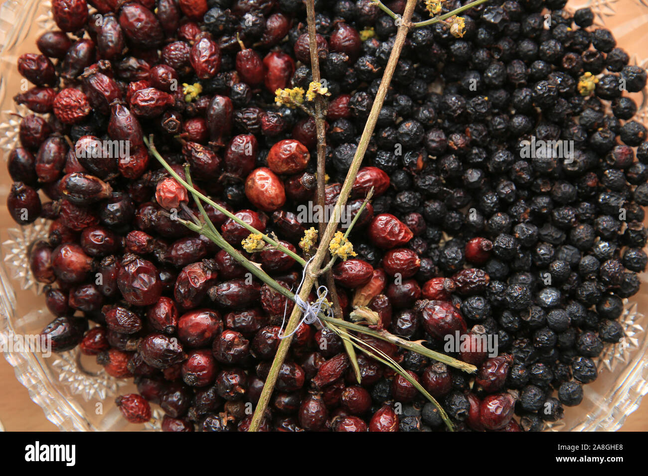 Hawthorn on wooden rustic table background. Rose hips haw fruit of the ...
