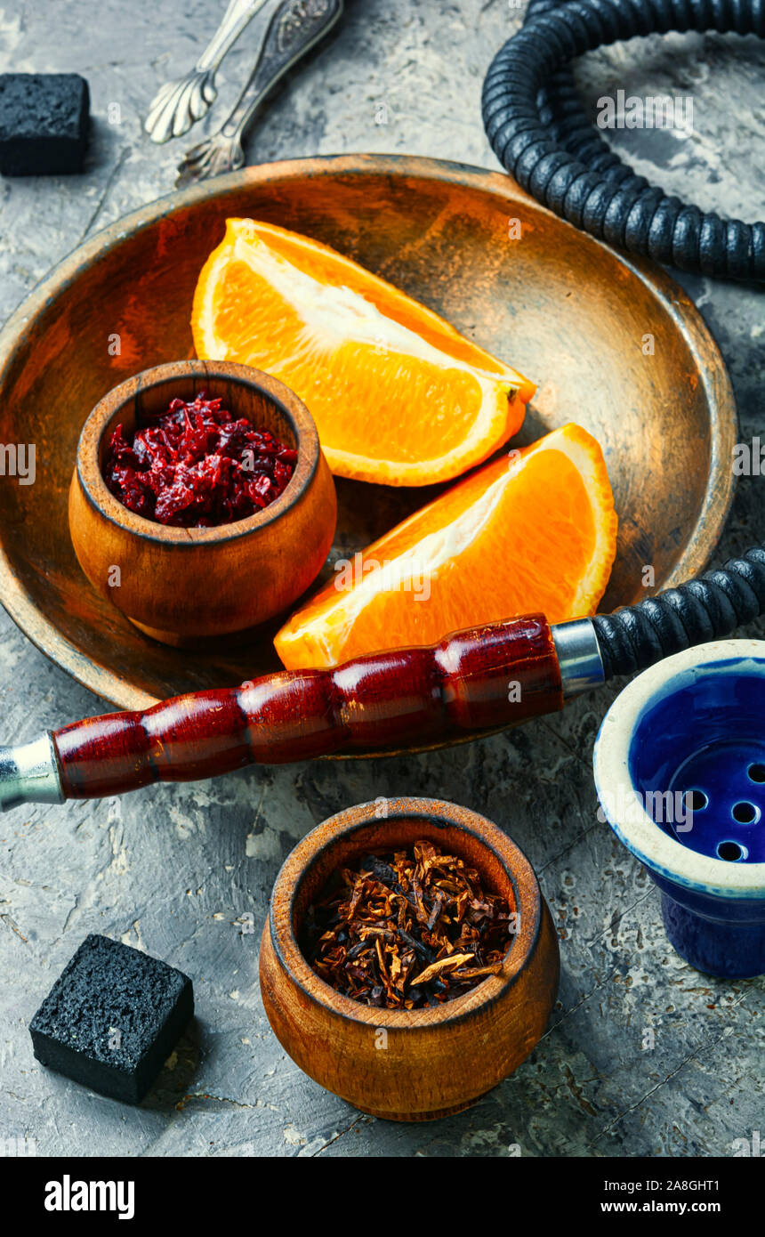 Smoking turkish shisha with orange.Details of Oriental hookah.Egyptian ...