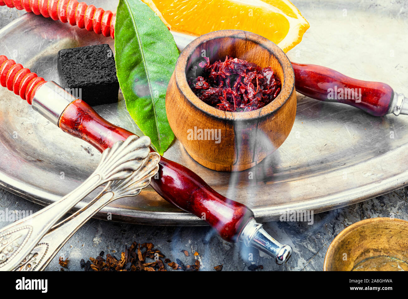 Smoking turkish shisha with orange.Details of Oriental hookah.Egyptian ...