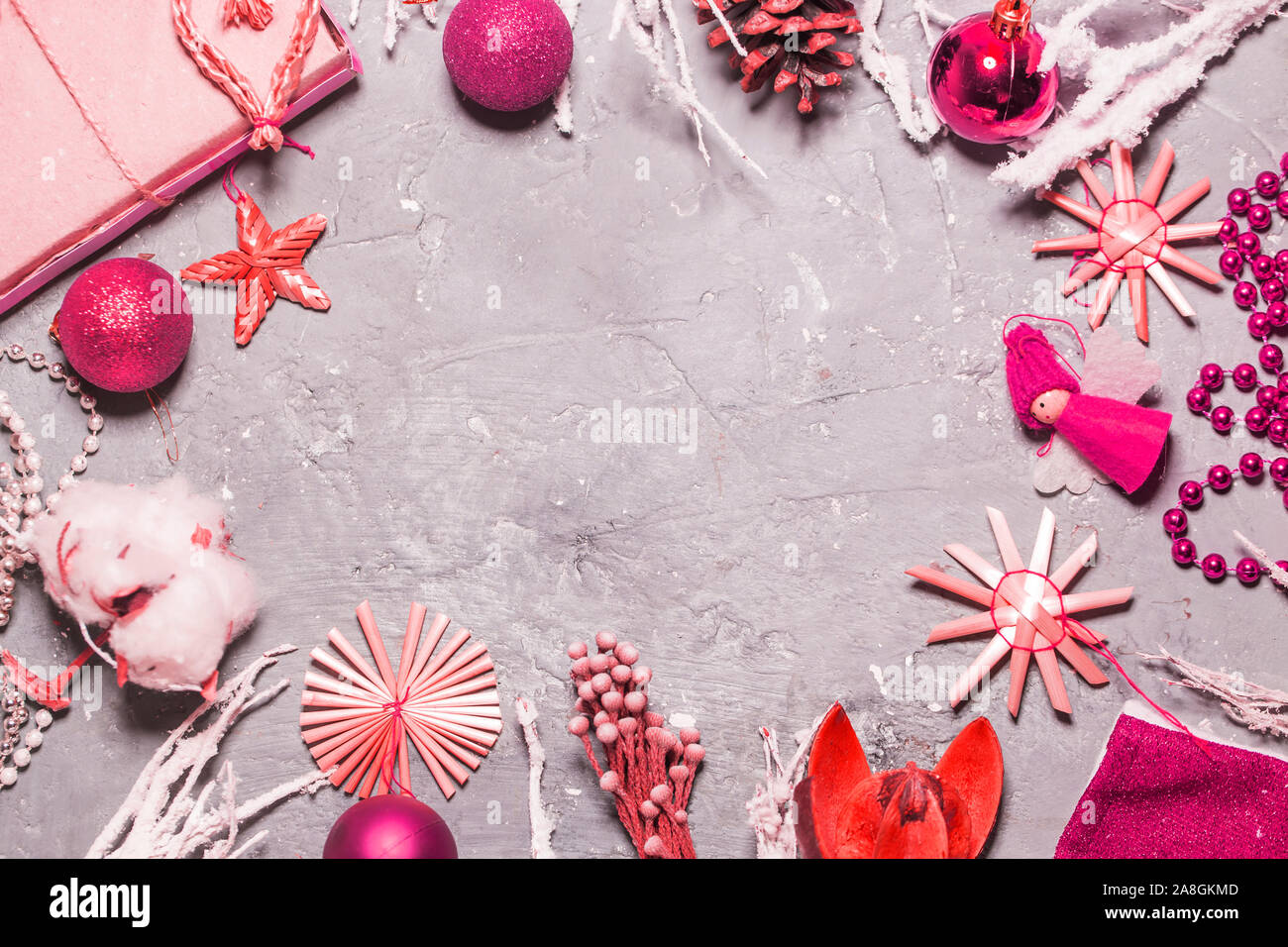 Closeup top view of beautiful pink toys, balls, cones and branches on ...
