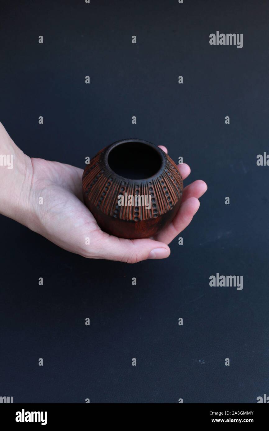 traditional red clay cup gourd for yerba mate tea on black back ...