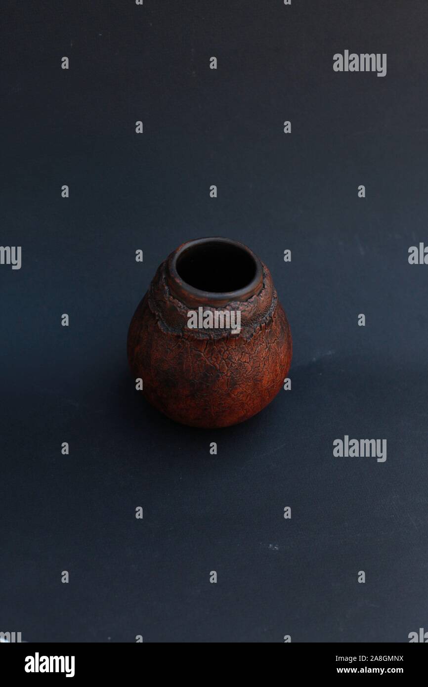 handmade red clay cup for yerba tea on black background, traditional ...
