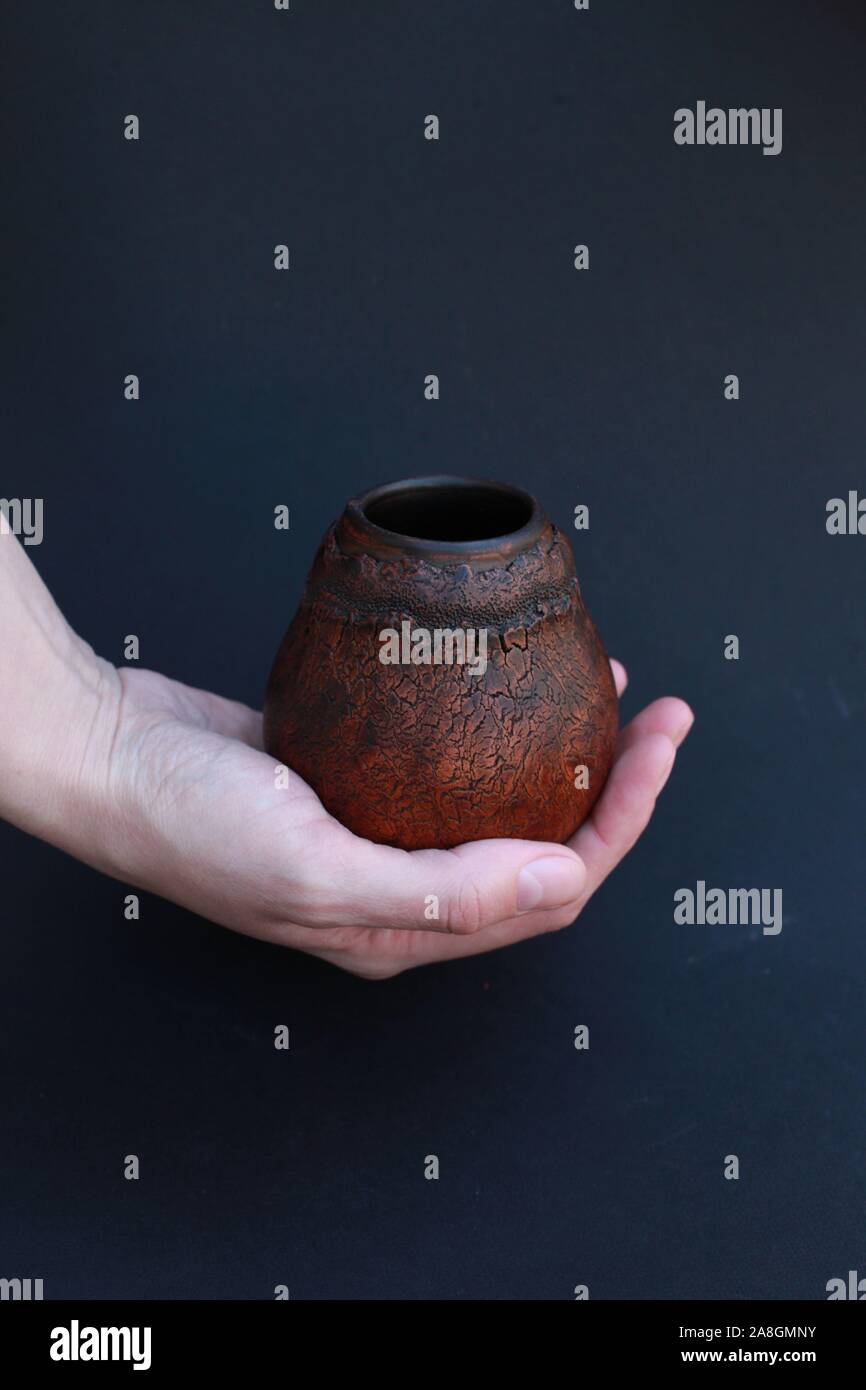 traditional red clay cup gourd for yerba mate tea on black back ...