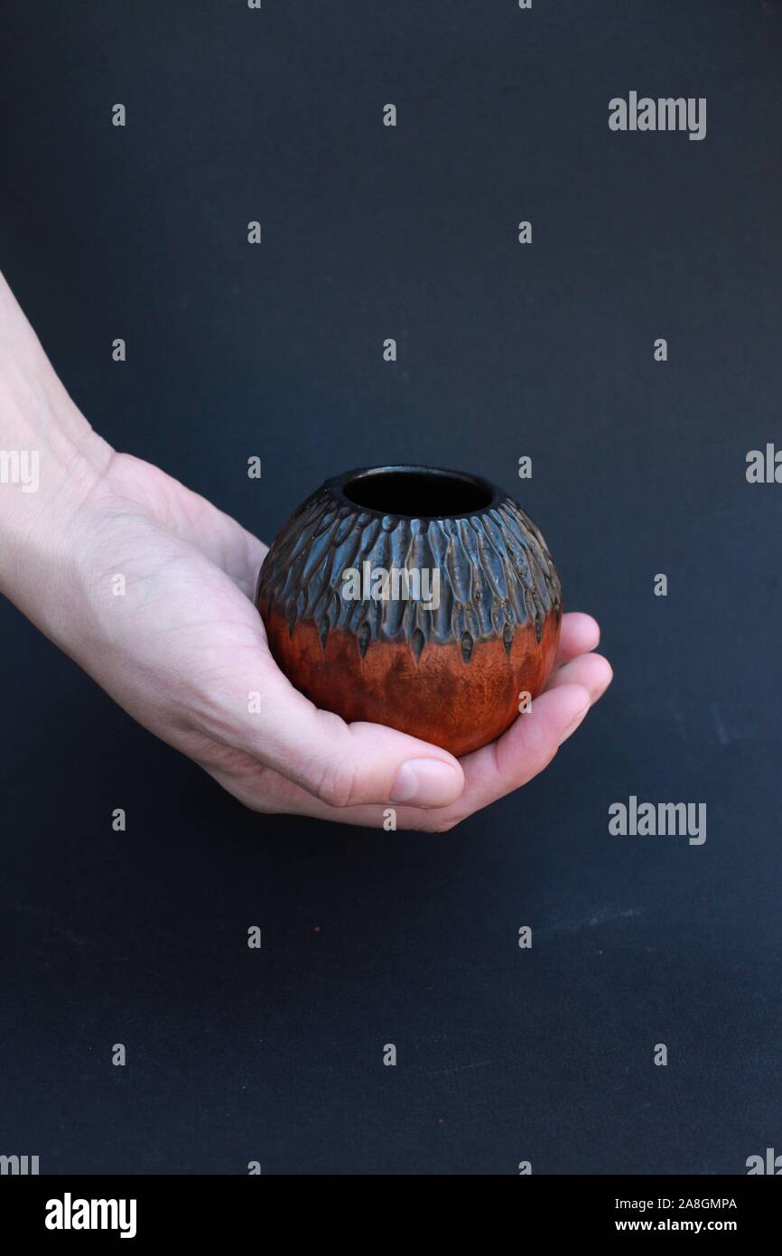 traditional red clay cup gourd for yerba mate tea on black back ...