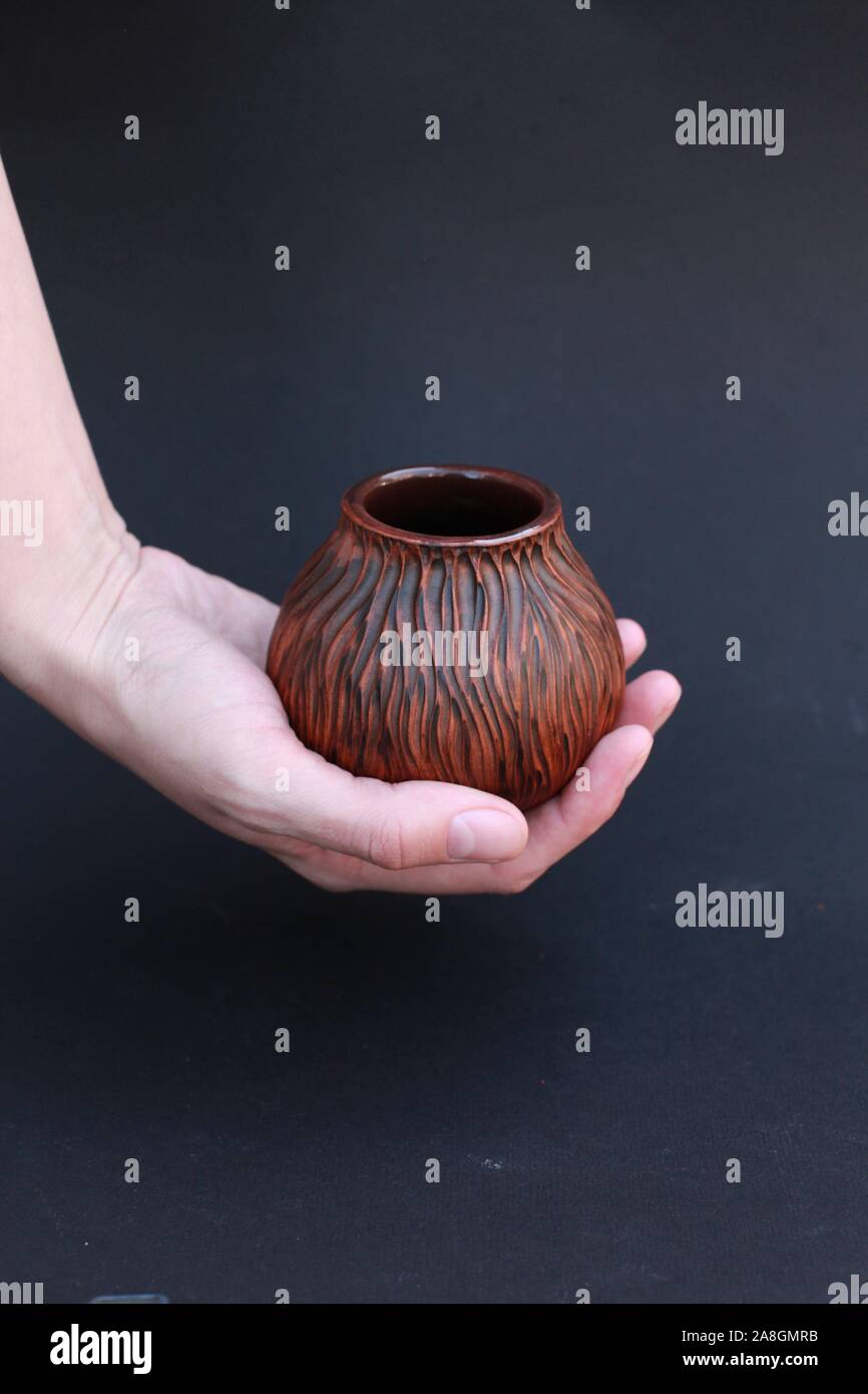 handmade red clay cup for yerba tea on black background, traditional ...