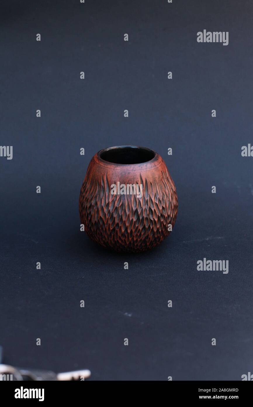 handmade red clay cup for yerba tea on black background, traditional ...