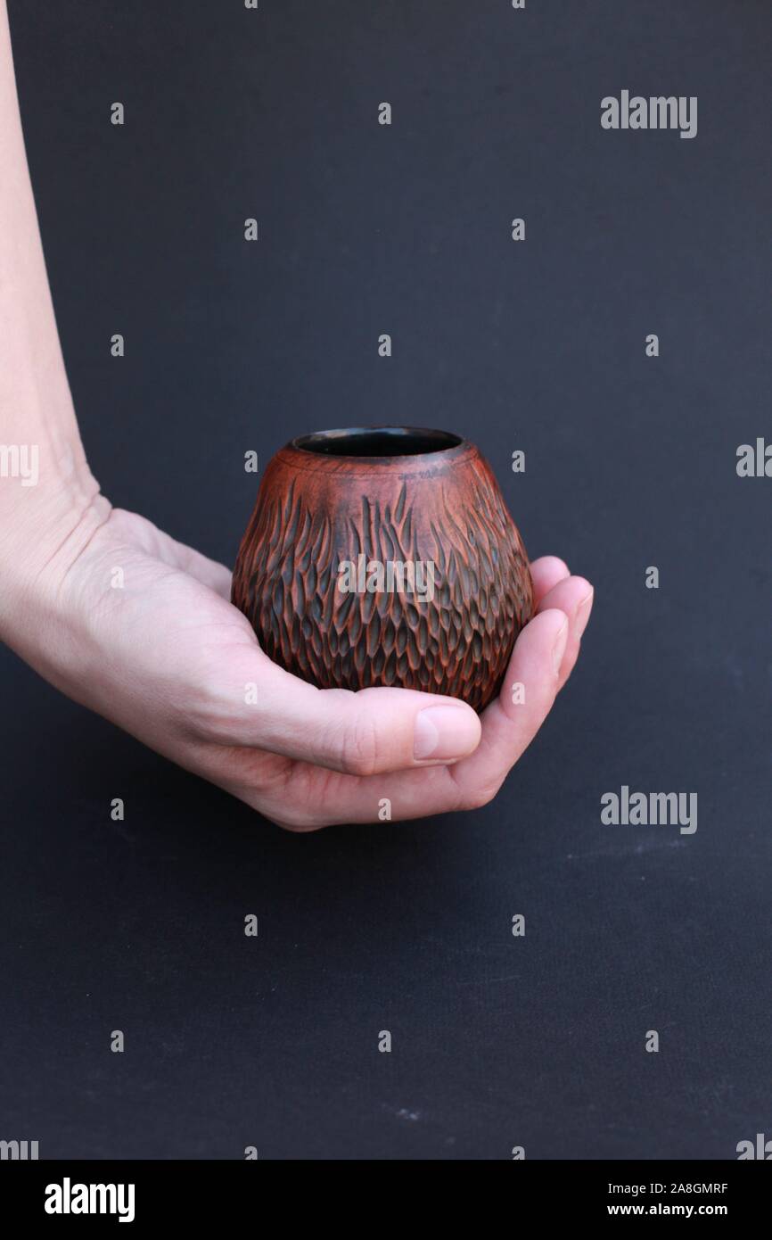 traditional red clay cup gourd for yerba mate tea on black back ...