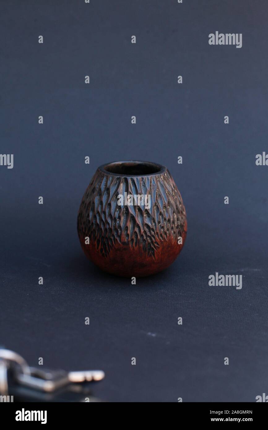 handmade red clay cup for yerba tea on black background, traditional ...