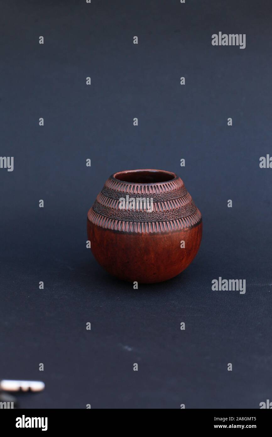 handmade red clay cup for yerba tea on black background, traditional ...