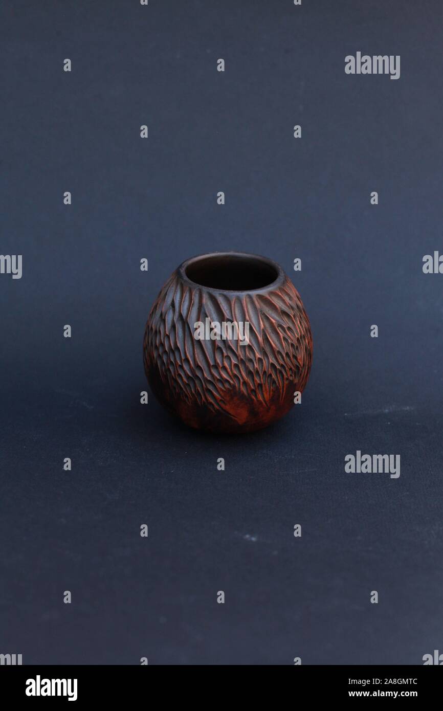 handmade red clay cup for yerba tea on black background, traditional ...