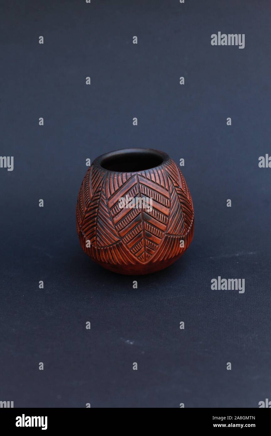 handmade red clay cup for yerba tea on black background, traditional ...