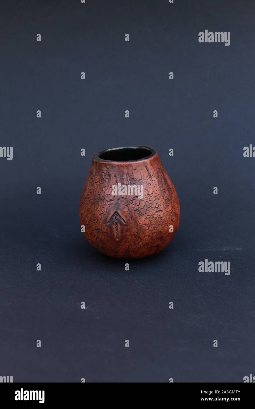 handmade red clay cup for yerba tea on black background, traditional ...