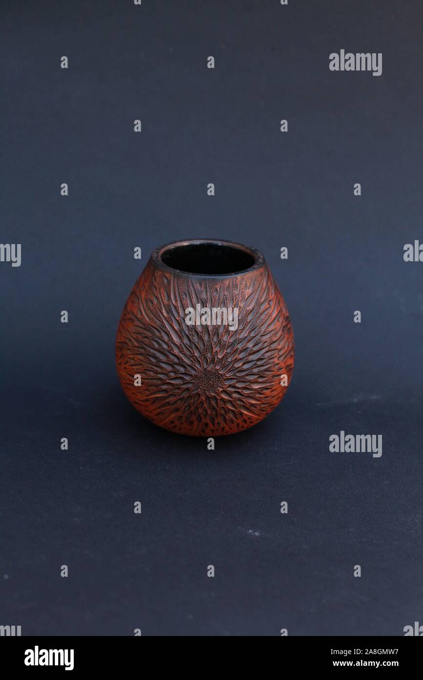 handmade red clay cup for yerba tea on black background, traditional ...