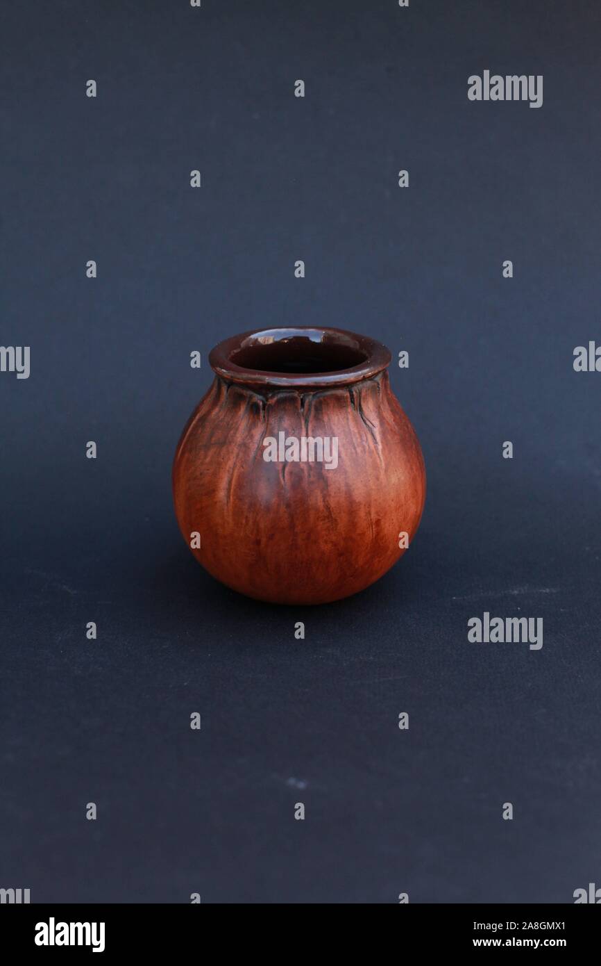 handmade red clay cup for yerba tea on black background, traditional ...