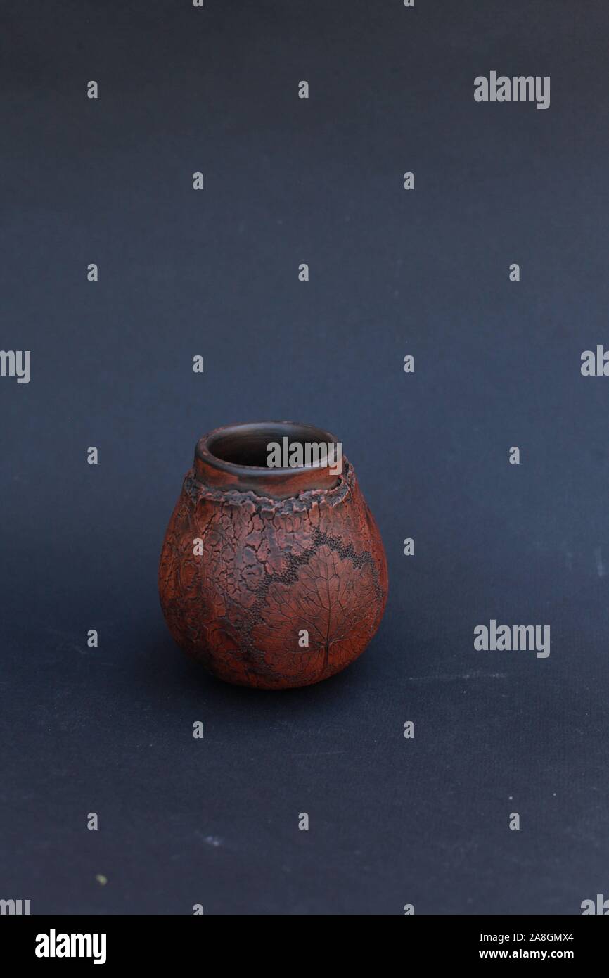 handmade red clay cup for yerba tea on black background, traditional ...