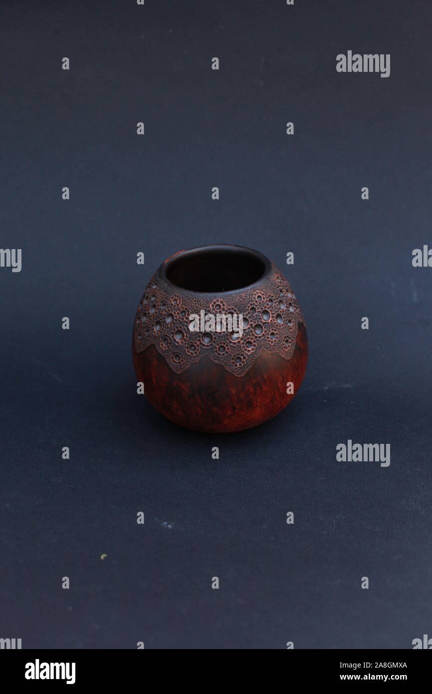 handmade red clay cup for yerba tea on black background, traditional ...