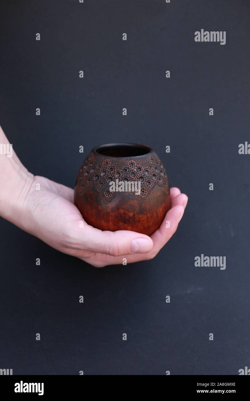 traditional red clay cup gourd for yerba mate tea on black back ...