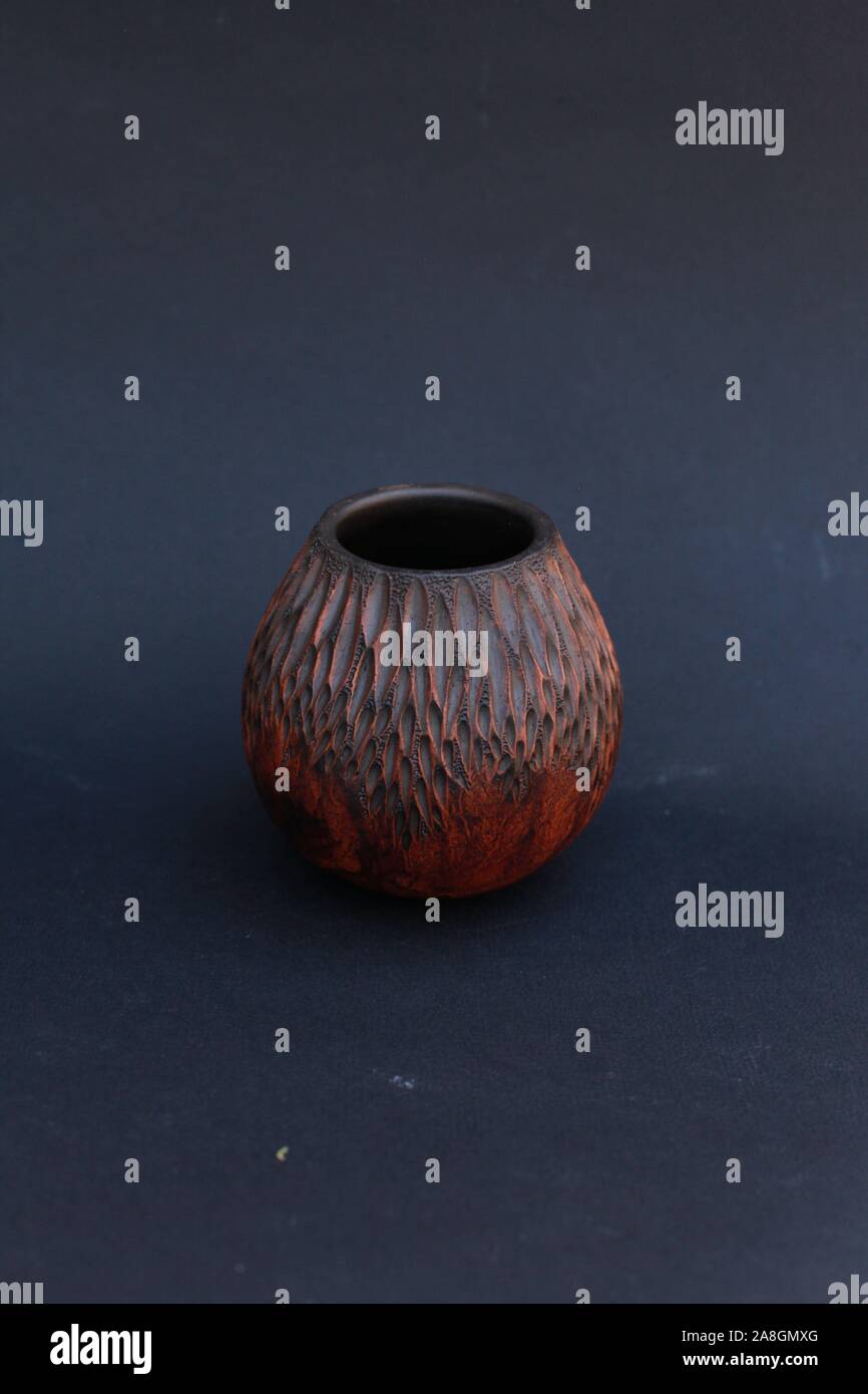 handmade red clay cup for yerba tea on black background, traditional ...