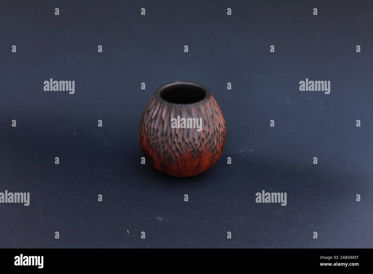 handmade red clay cup for yerba tea on black background, traditional ...