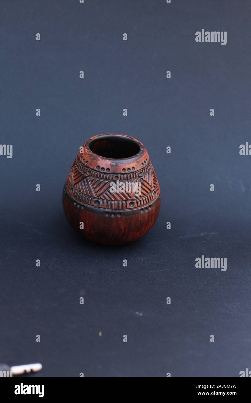 handmade red clay cup for yerba tea on black background, traditional ...
