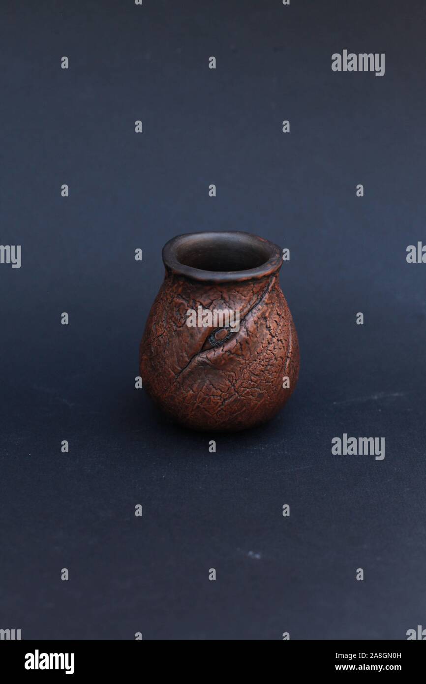 handmade red clay cup for yerba tea on black background, traditional ...