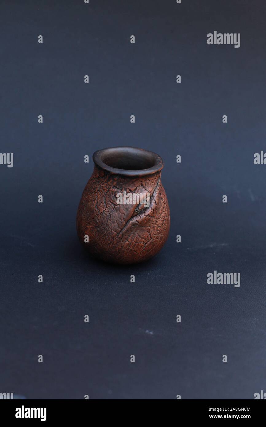 handmade red clay cup for yerba tea on black background, traditional ...