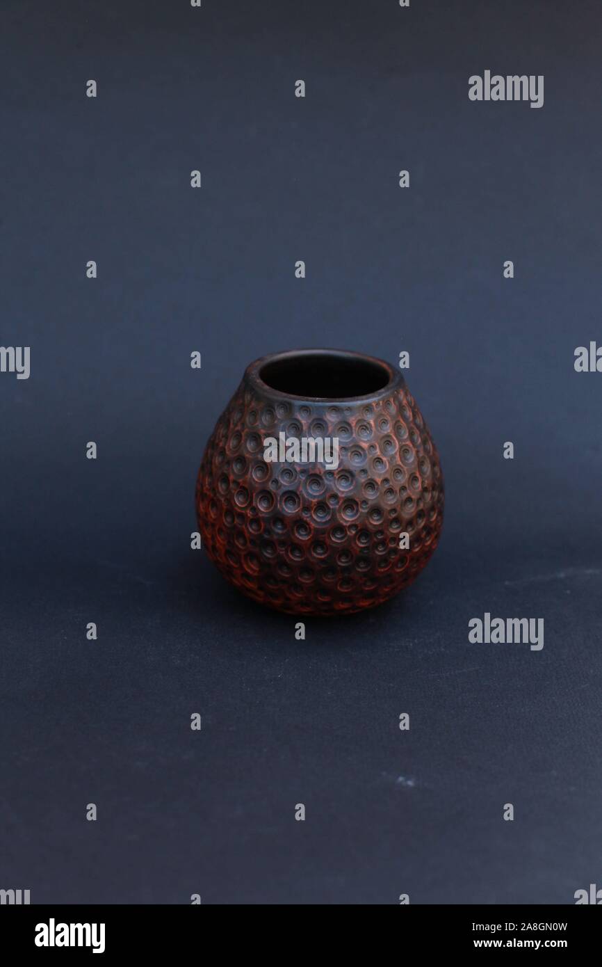 handmade red clay cup for yerba tea on black background, traditional ...