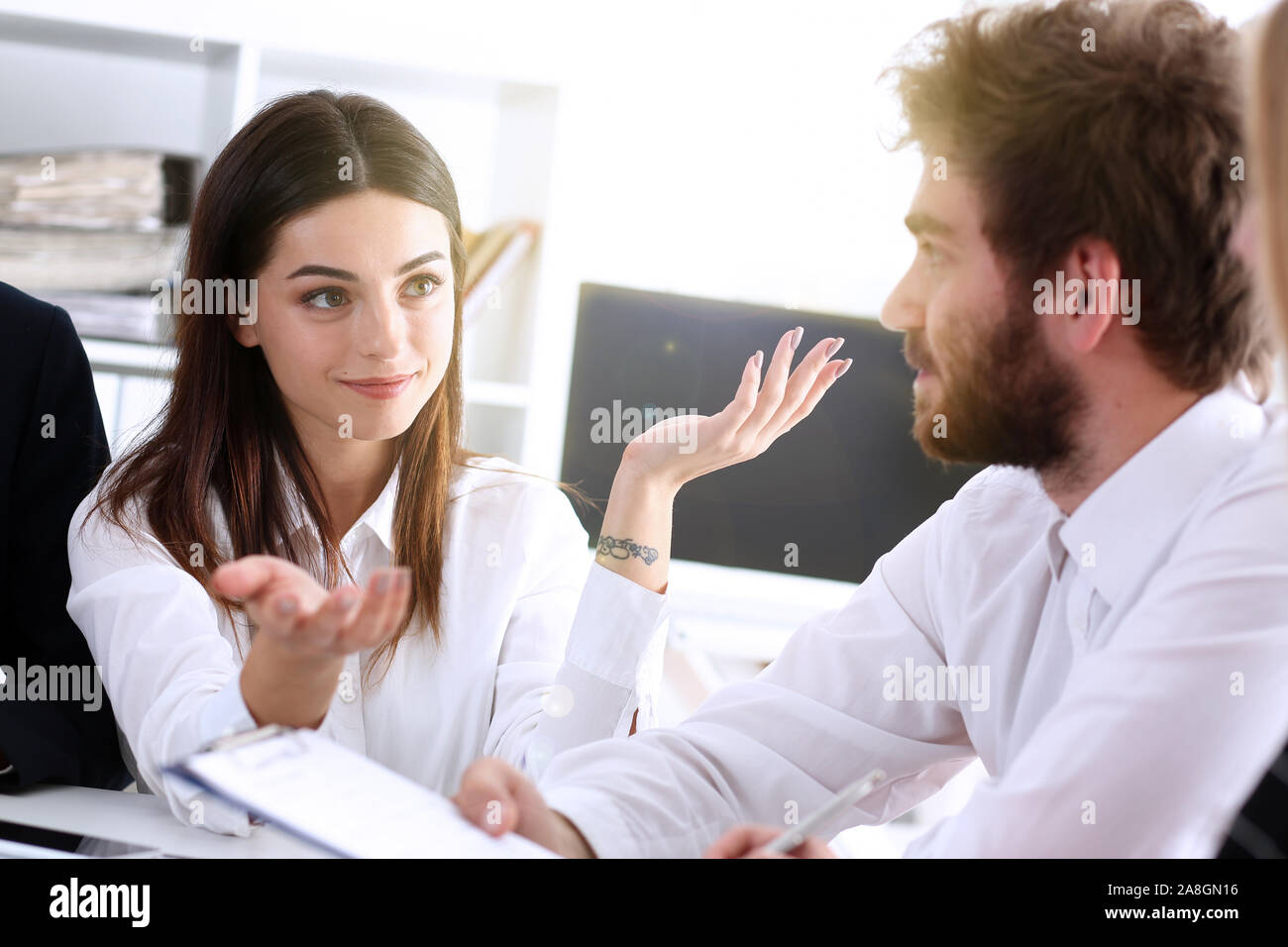 Group of people sit in office deliberate on problem Stock Photo - Alamy