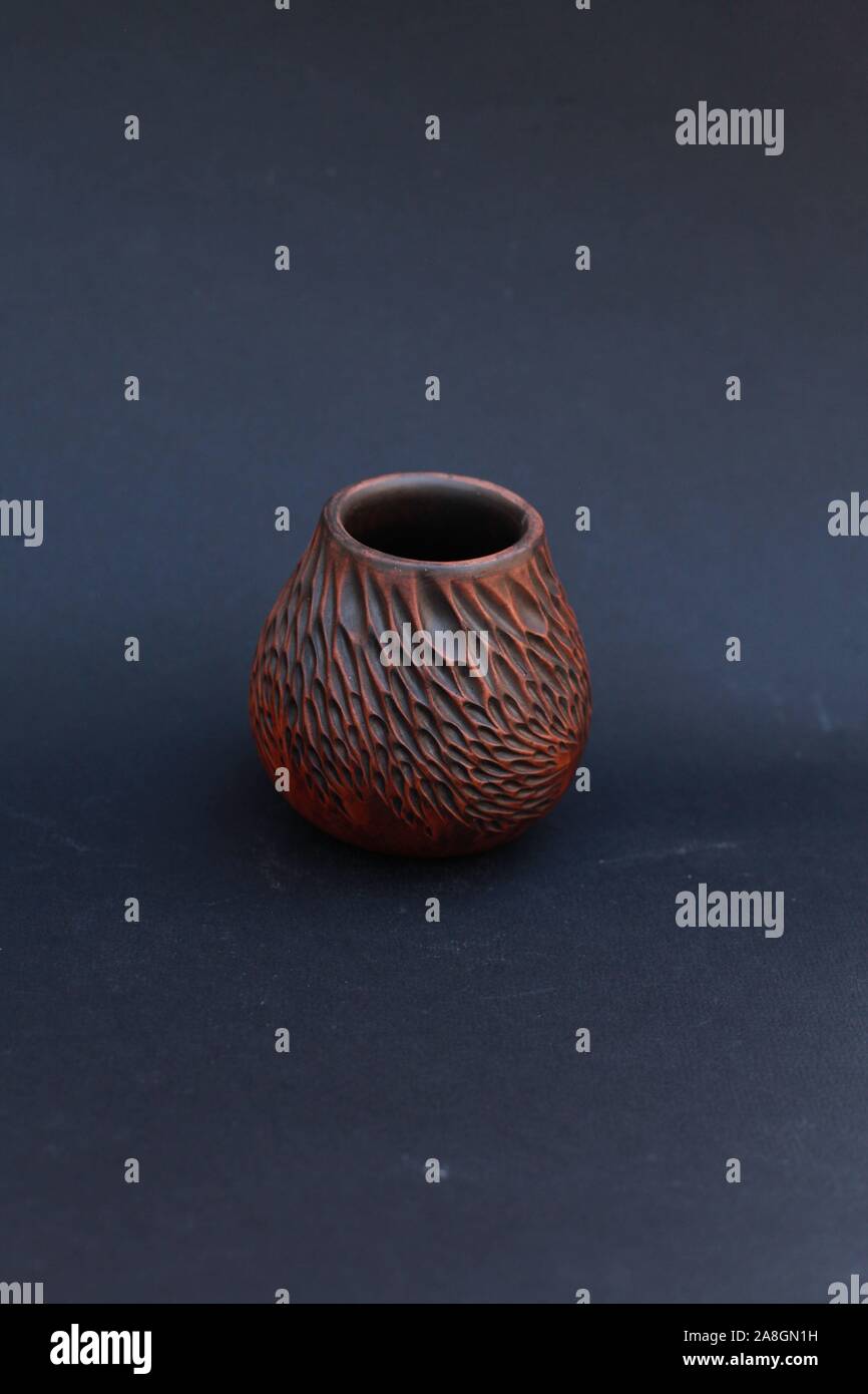 handmade red clay cup for yerba tea on black background, traditional ...