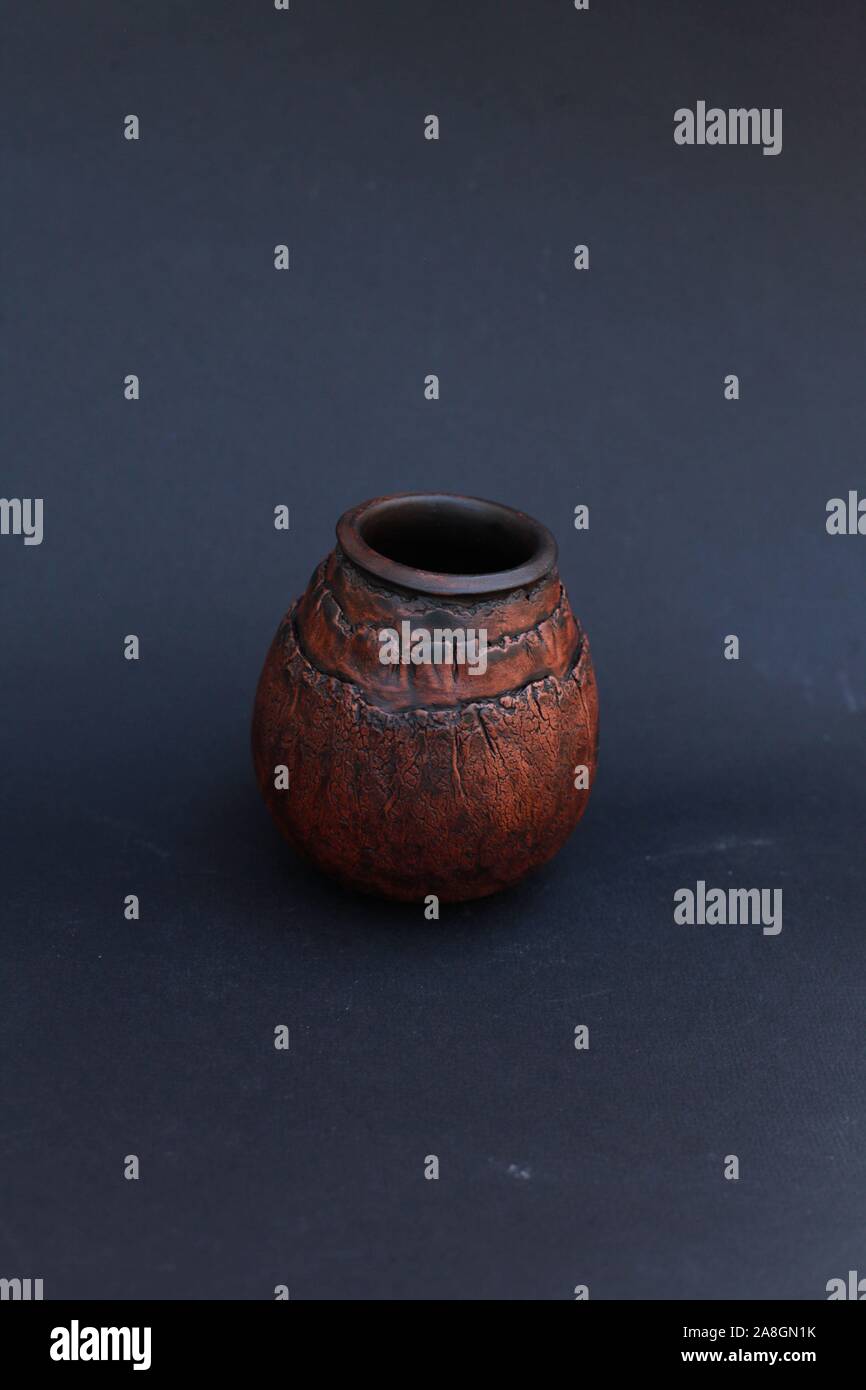 handmade red clay cup for yerba tea on black background, traditional ...
