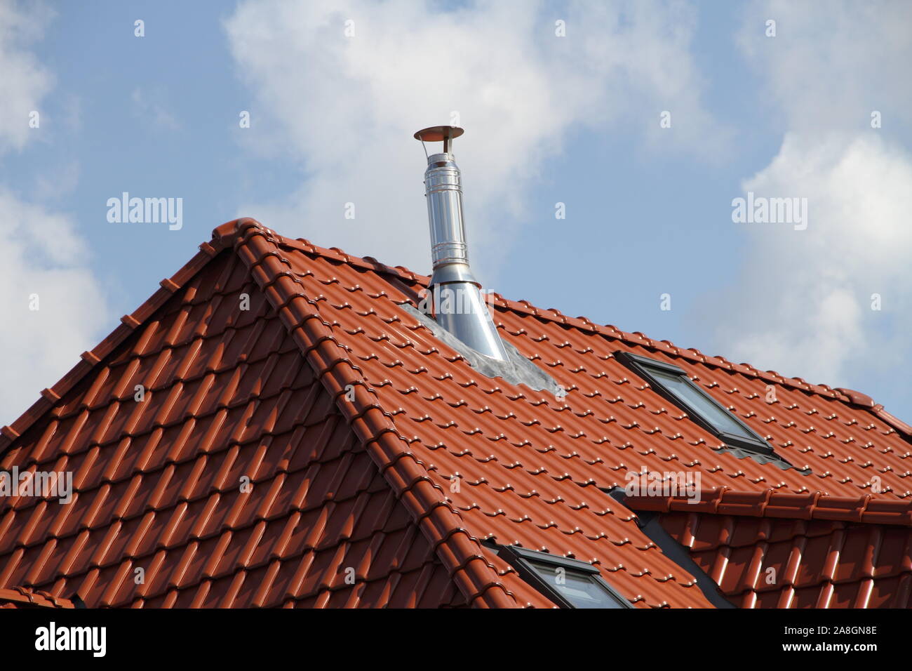 new stainless steel chimney on a house Stock Photo - Alamy