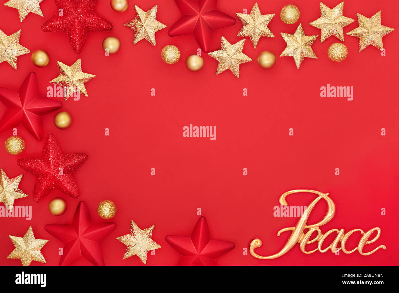 Christmas gold peace sign with star and bauble decorations on red ...