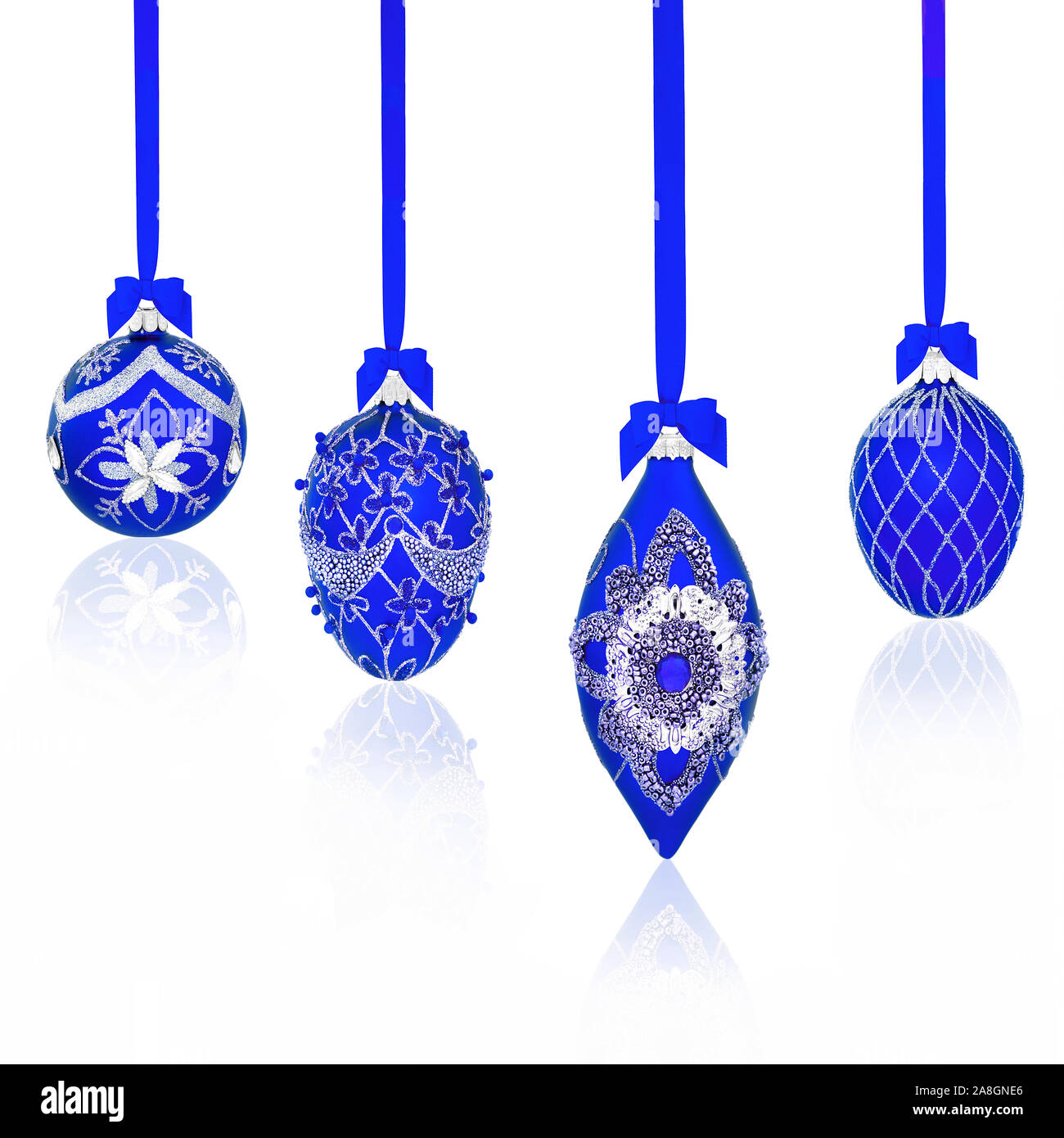 Luxury blue Christmas tree bauble decorations with bows and ribbons on ...