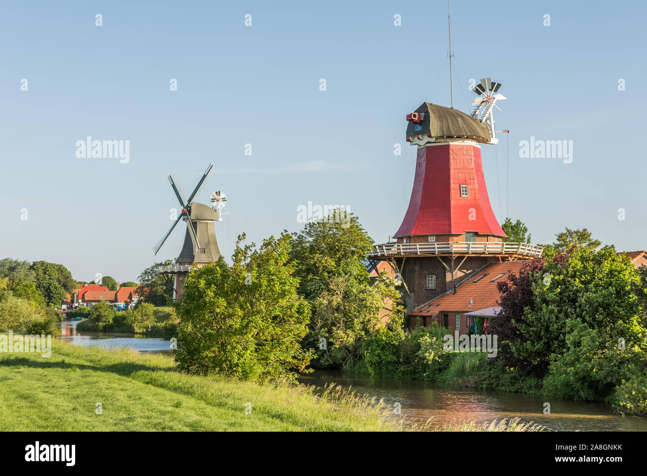 The historic Twin Mills, Greetsiel, Krummhoern, East Frisia, Germany ...