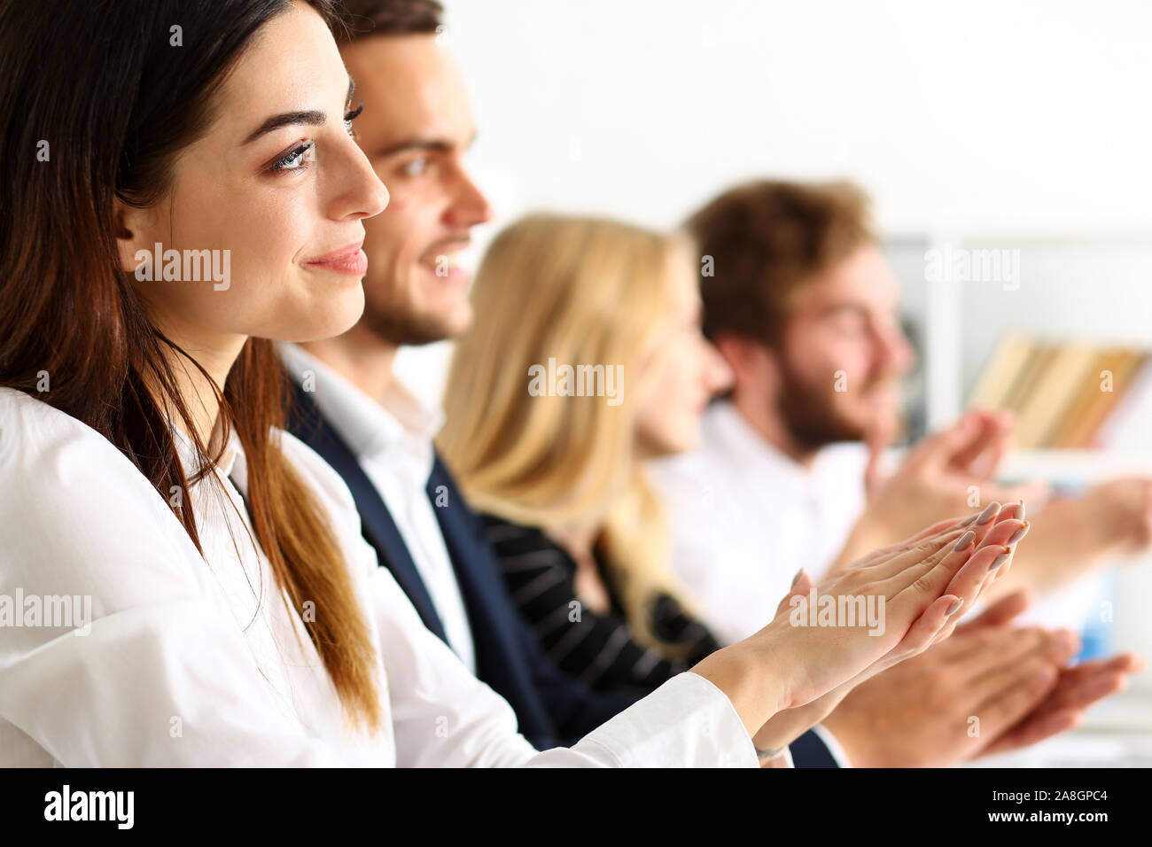 Group of people clap their arm in row Stock Photo - Alamy