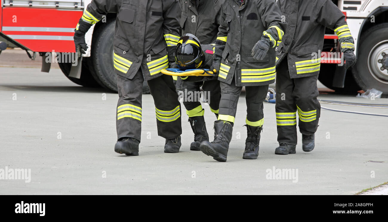 firemen stretcher bearer after the road crash on the road Stock Photo ...