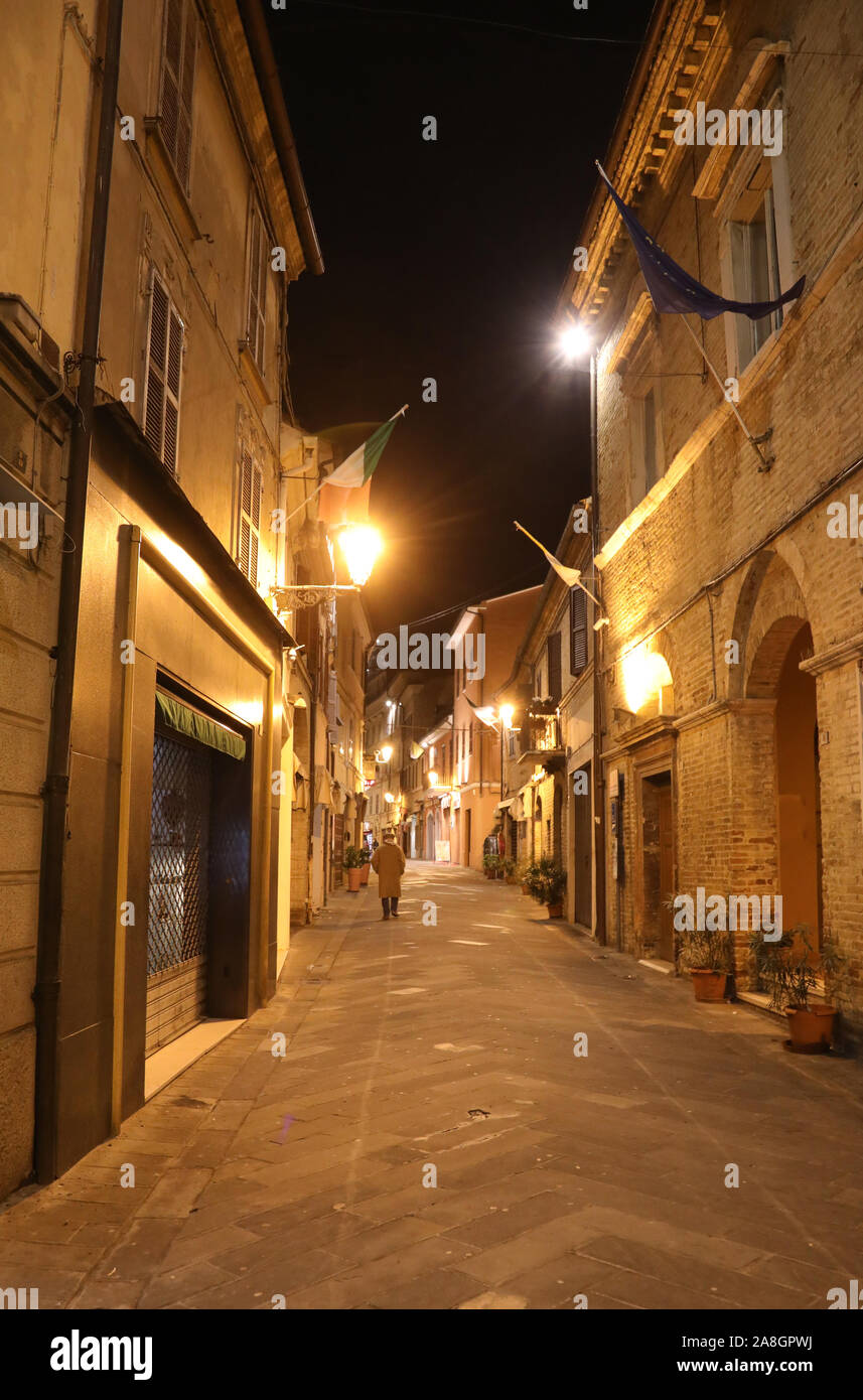 narrow street on Loreto Town in Italy by night Stock Photo - Alamy
