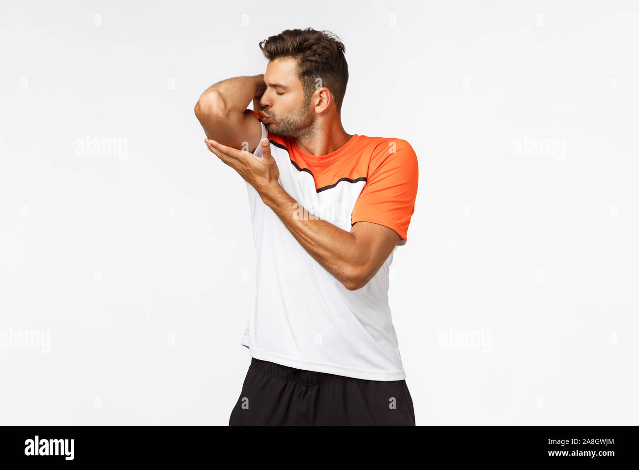 Self-centered handsome macho man, sportsman in activewear, bragging own ...