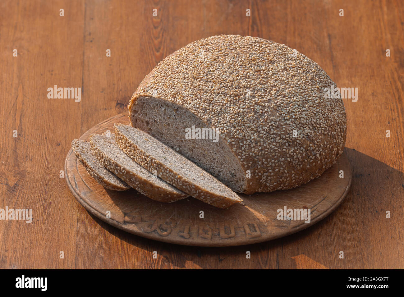 six grain round sour dough bread loaf Stock Photo - Alamy