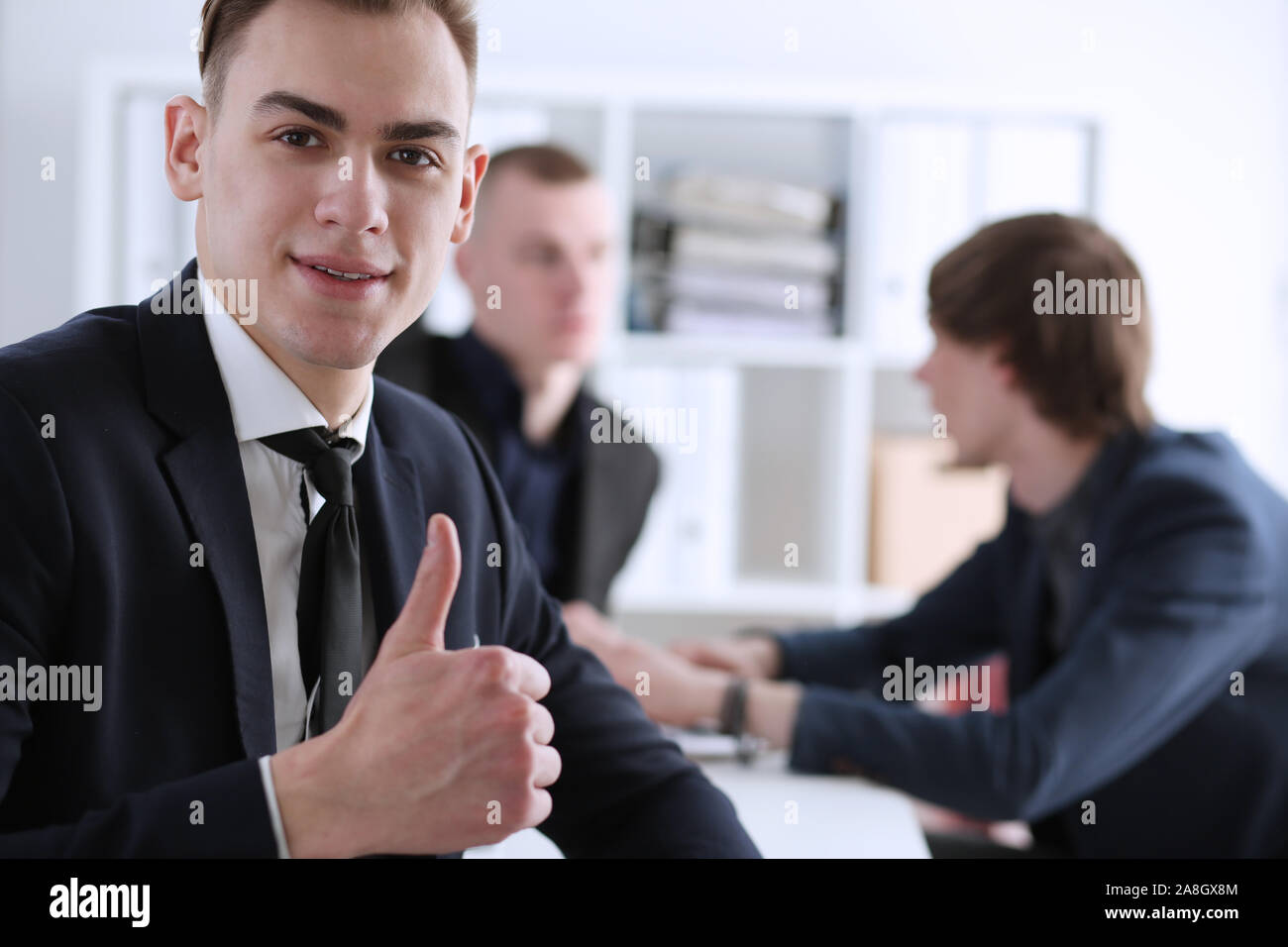 Male hand showing OK or approval sign with thumb up Stock Photo - Alamy