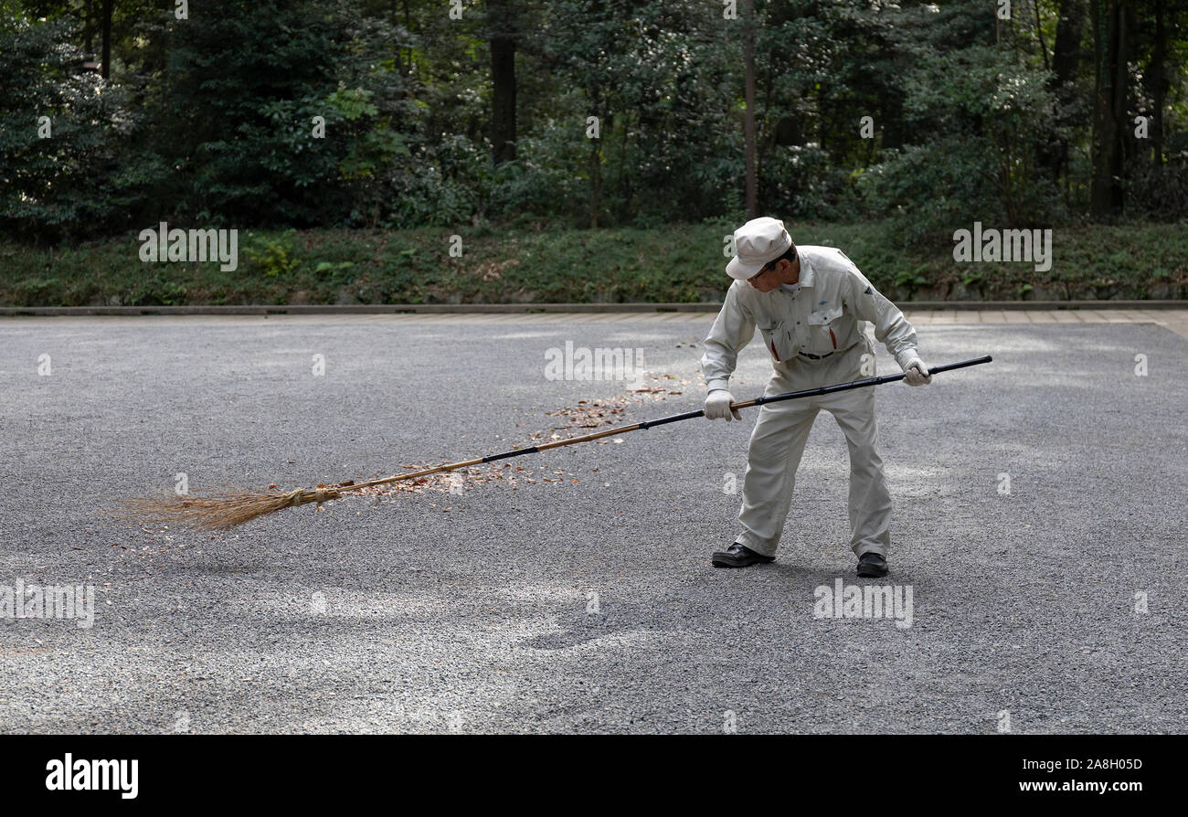 Man sweeping street hi-res stock photography and images - Alamy