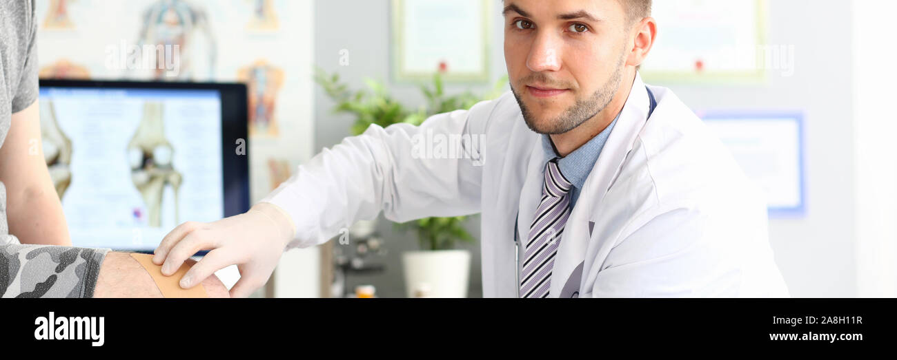 Serious traumatologist at workplace Stock Photo - Alamy