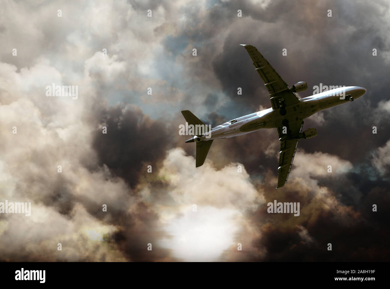 an airplane flying in the storm Stock Photo - Alamy