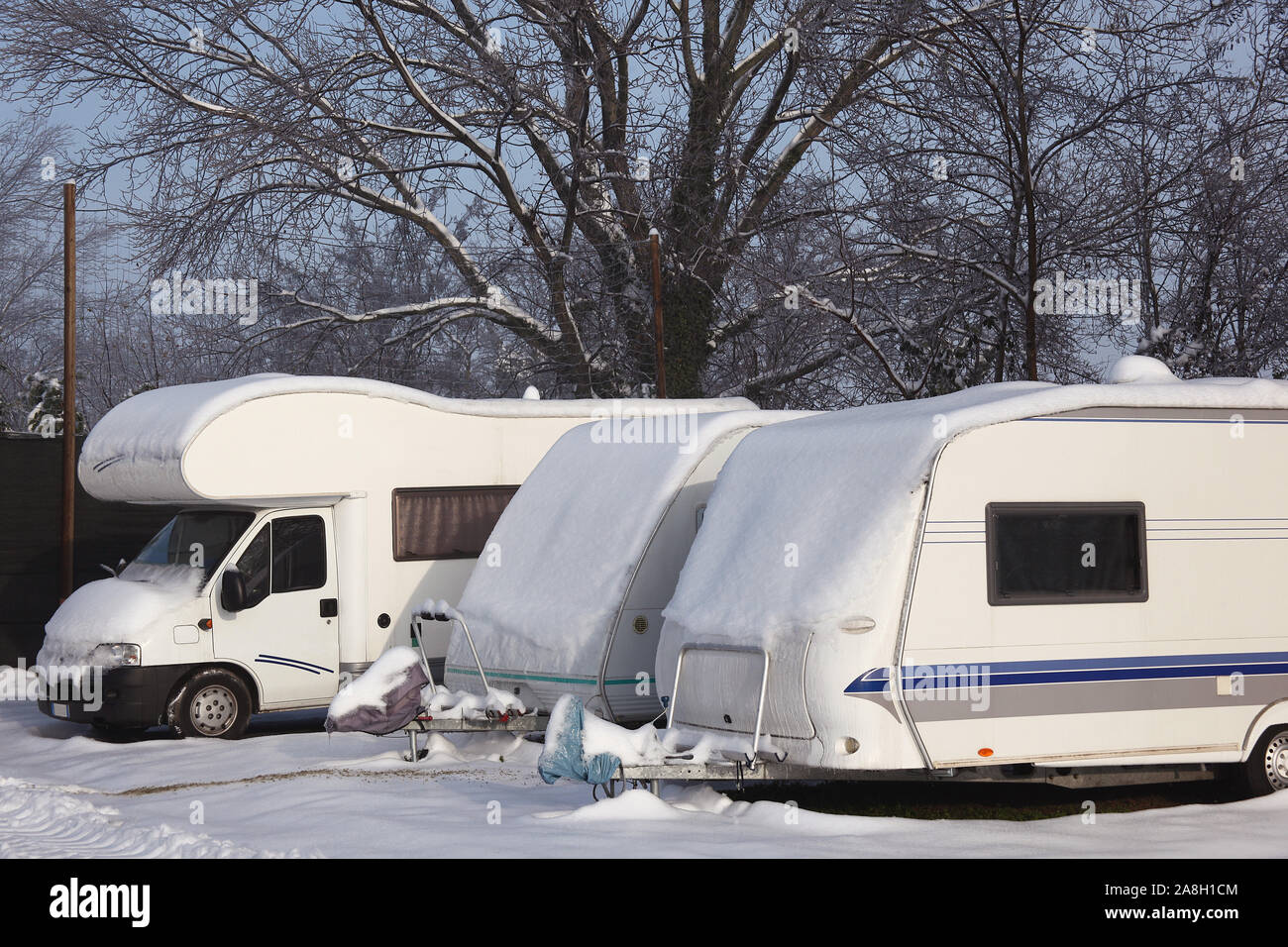 motorhome and caravan at winter with snow Stock Photo - Alamy