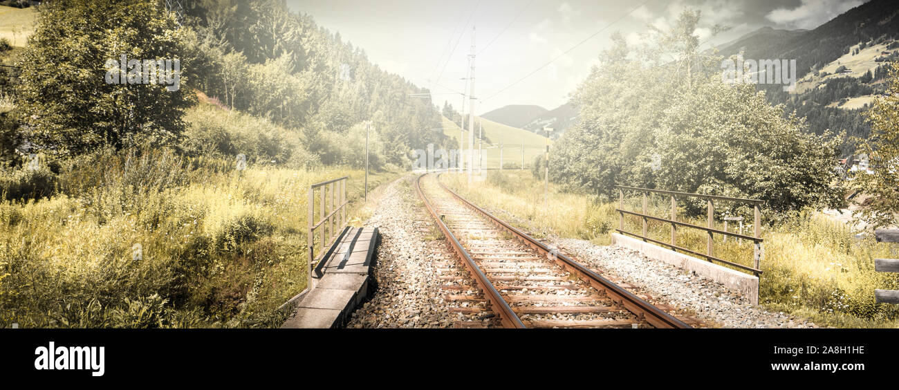 Train rails in Mountain landscape Stock Photo - Alamy