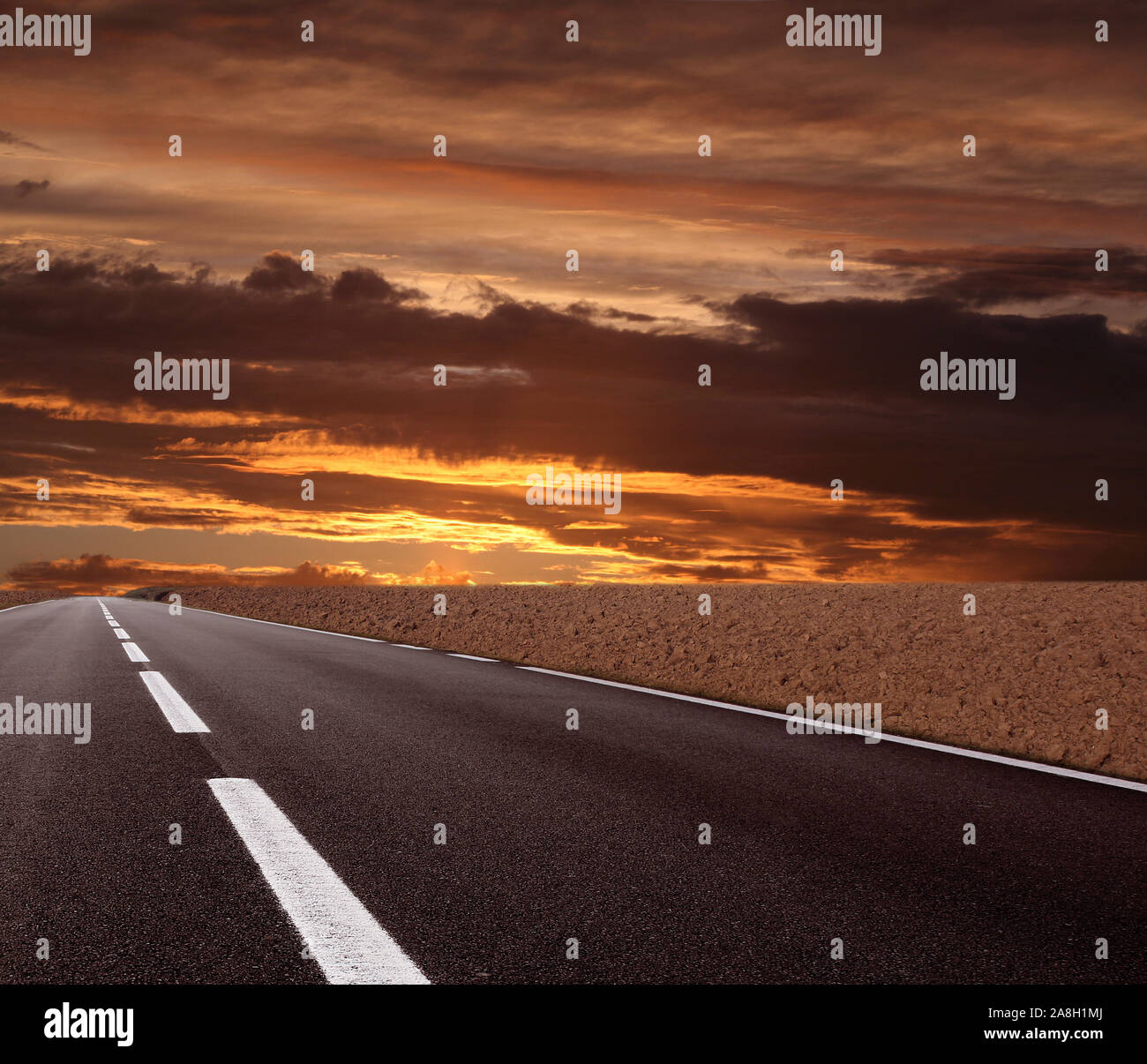 a fantastic desert road with clouds Stock Photo - Alamy
